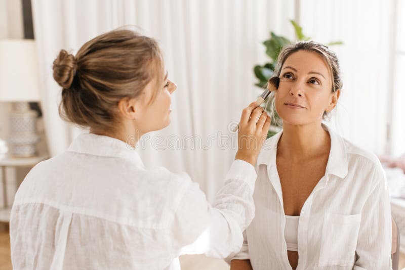Pleasant Adult Caucasian Woman at Reception of Young Make-up Artist in ... Pleasant Adult Caucasian Woman at Reception of Young Make-up Artist in ...