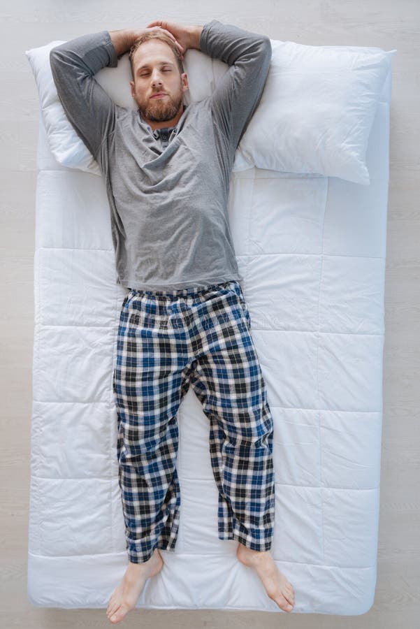 Pleasant Bearded Man Lying on the Bed Stock Image - Image of blanket ...