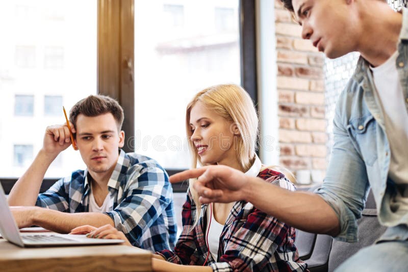 Pleasant Involved Students Discussing Project Stock Photo - Image of ...