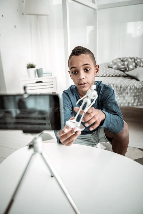 Pleasant Nice Boy Showing a Skeleton Model To the Camera Stock Image ...