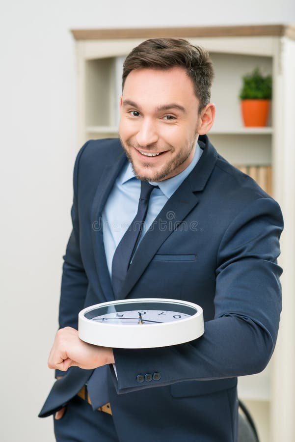 Pleasant Office Worker Holding Clock Stock Photo - Image of active ...