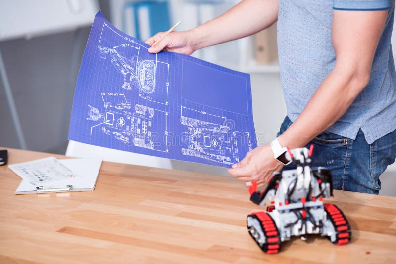 Pleasant Professional Engineer Holding a Scheme Stock Photo - Image of ...