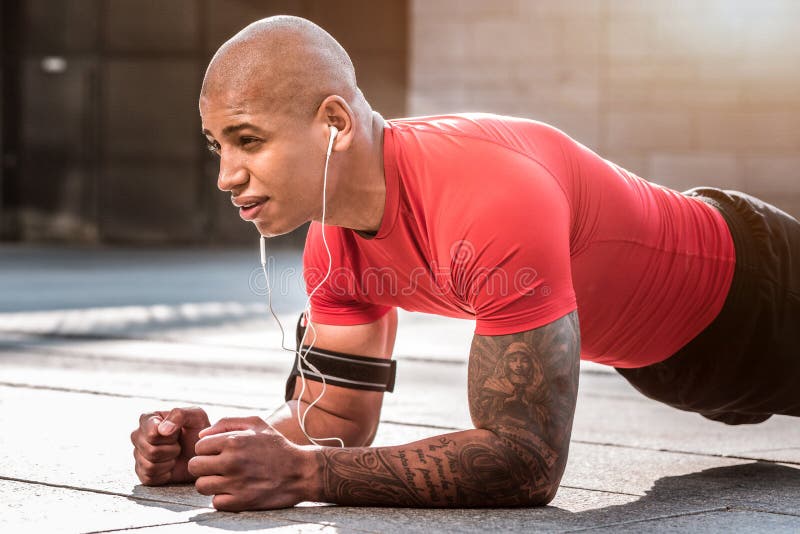 Concentrated Well-built Young Man Sitting on the Chair Stock Image ...