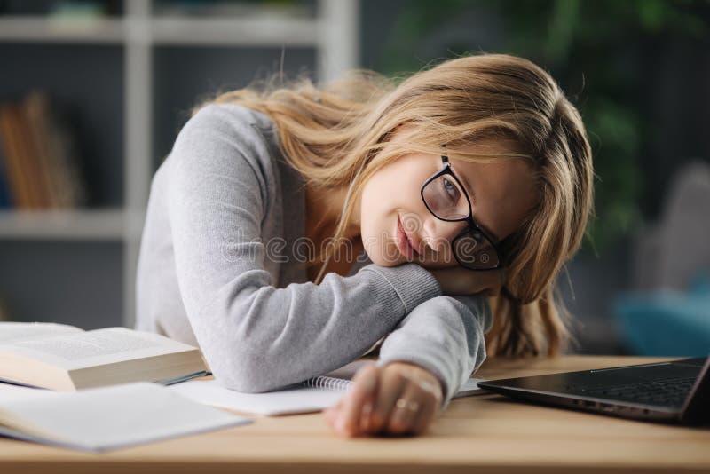 Student resting on table stock photo. Image of tired - 214827292