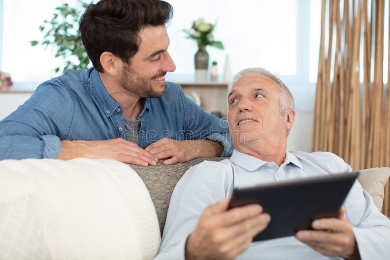 Pleasant Young Man and Elderly Father Stock Photo - Image of care, aged ...