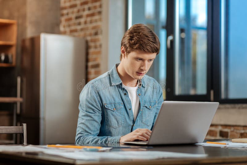 Pleasant Young Man Working on the Laptop Stock Photo - Image of male ...