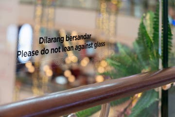 "Please Do Not Lean Against Glass" Sticker on the Glass Railing Stock ...