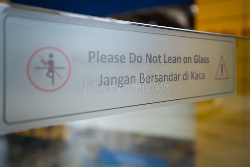 "Please Do Not Lean on Glass" Sticker on the Glass Railing Stock Photo ...