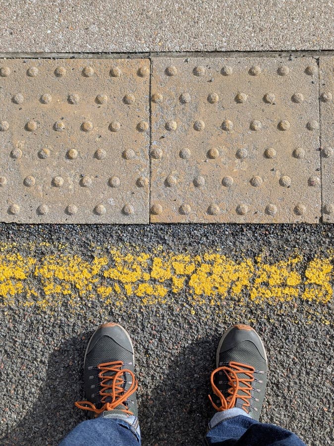 Please Stand Behind the Yellow Line Stock Photo - Image of feet ...
