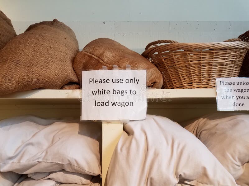 Please Use only White Bags To Load Wagon Sign on Shelf Stock Photo ...