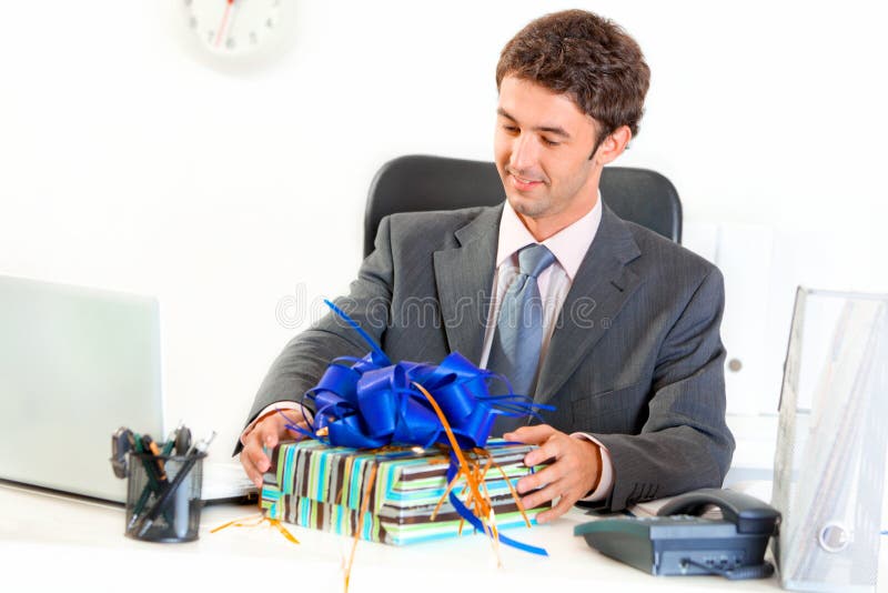Pleased Businessman in Office Looking on Gift Stock Photo - Image of ...