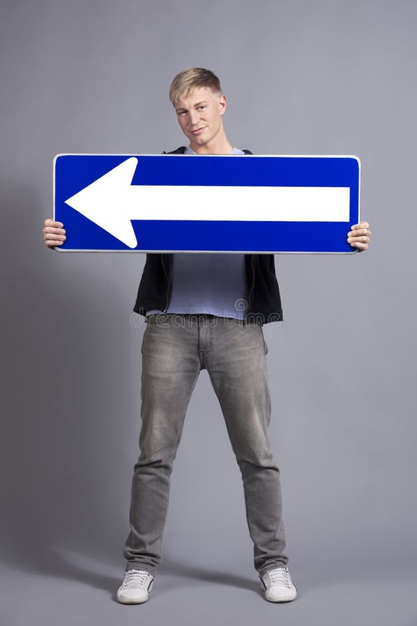 Pleased Man Holding Direction Arrow Sign Pointing Up. Stock Image ...
