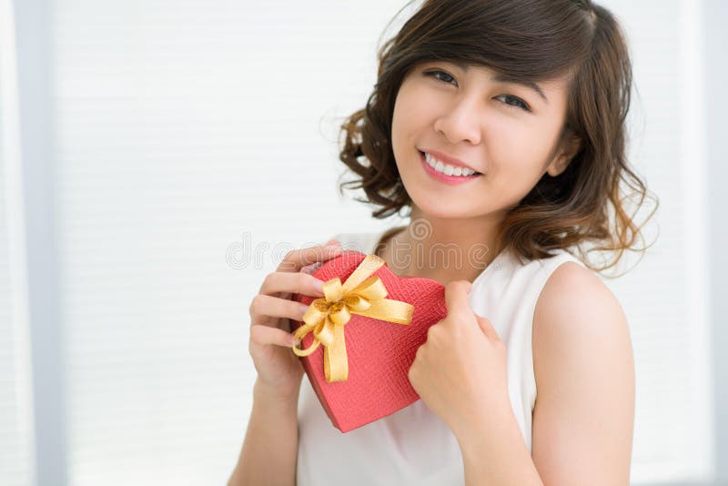 Pleased with present stock image. Image of looking, birthday - 28360985