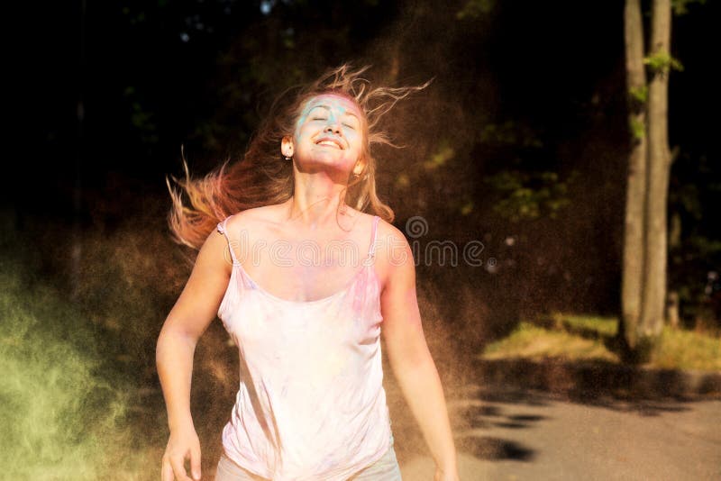 Pleased Smiling Model with Wind in Hair Jumping with Exploding D Stock ...