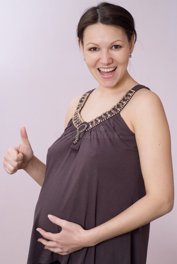Pleased Woman Standing and Smiling Stock Photo - Image of baby, girl ...