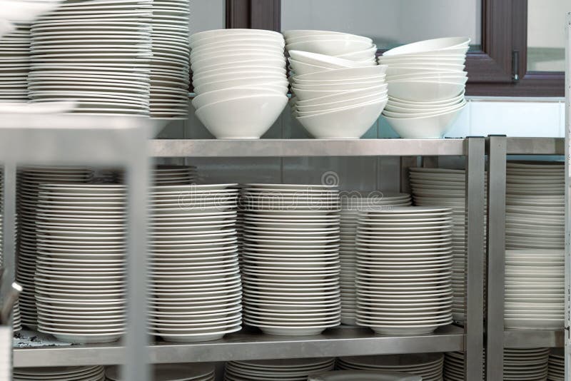 Plenty of Stacked Plates in the Kitchen Cupboard Close Up Stock Image ...