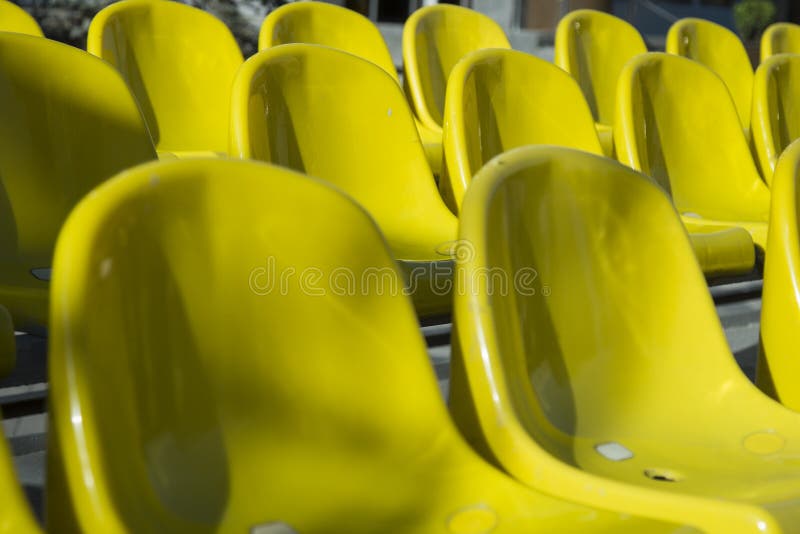 Plenty of Yellow Plastic Seats Stock Image - Image of event, color ...