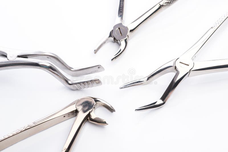 Pliers and Extraction Forceps on White Background Stock Photo - Image ...