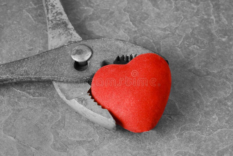 Pliers gripping heart. stock image. Image of crush, hurt - 37719575