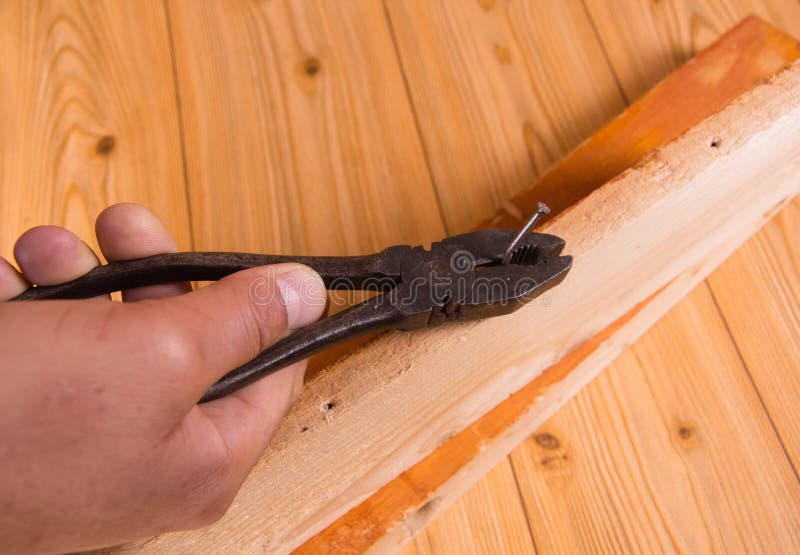 Pliers and nail stock image. Image of nail, wooden, pliers - 26789123