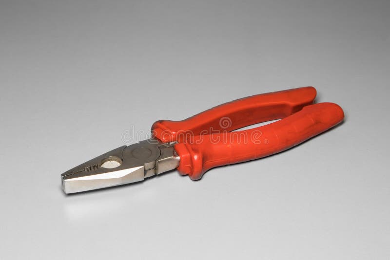 Pliers with Red Handles on the Table Close-up Stock Photo - Image of ...