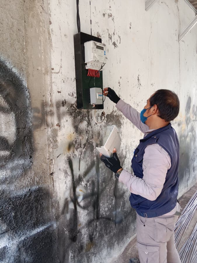 PLN Officer is Checking the Electricity Meter Editorial Photo - Image ...