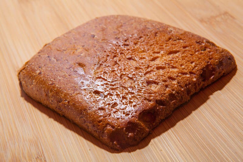 Sliced Piece of Bread on a Wooden Table Stock Image - Image of dice ...