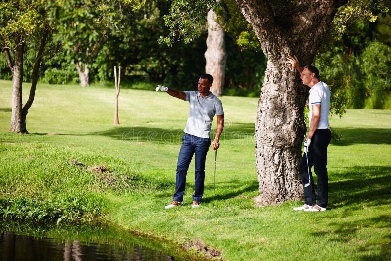 Plotting the Best Path. Two Men Standing at a Water Hazard Trying To ...