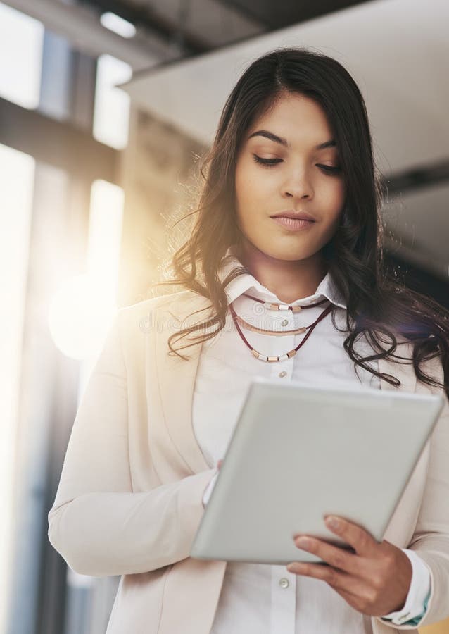 Plotting Her Course Digitally. a Young Businesswoman Working on a ...