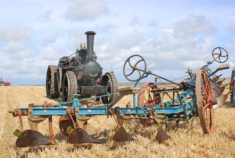 Plough and traction engine stock image. Image of field - 98522077