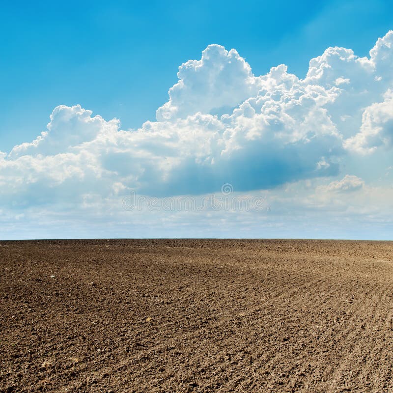 Plowed Field and Clouds Over it Stock Photo - Image of dirt, land: 35660830