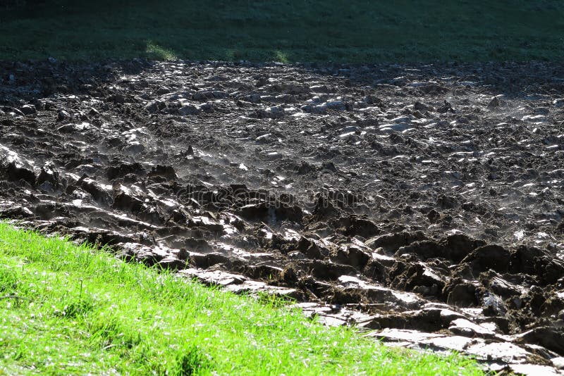Plowed soil steaming stock image. Image of farm, acreage - 67746637