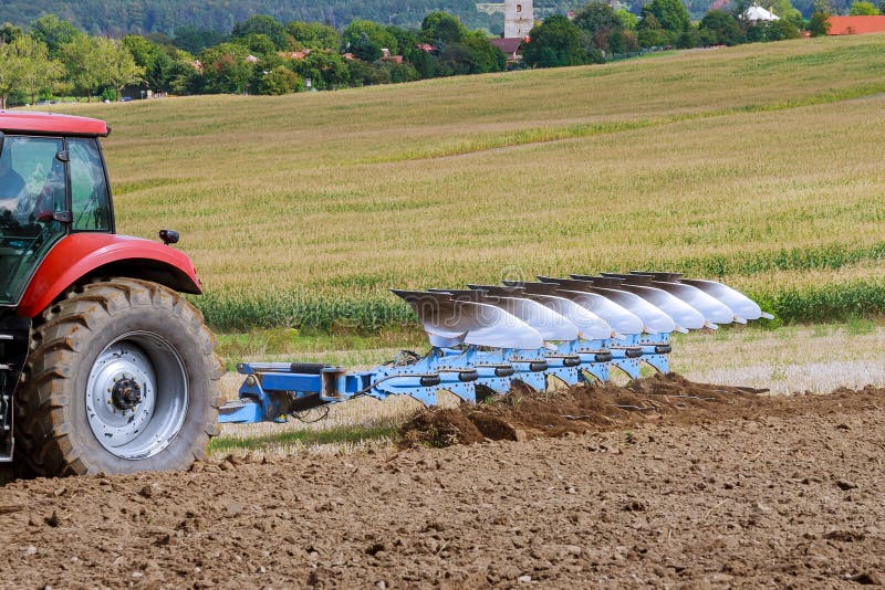 Plowing the Field. Large Plow on a Tractor. Tractor with Agricultural ...