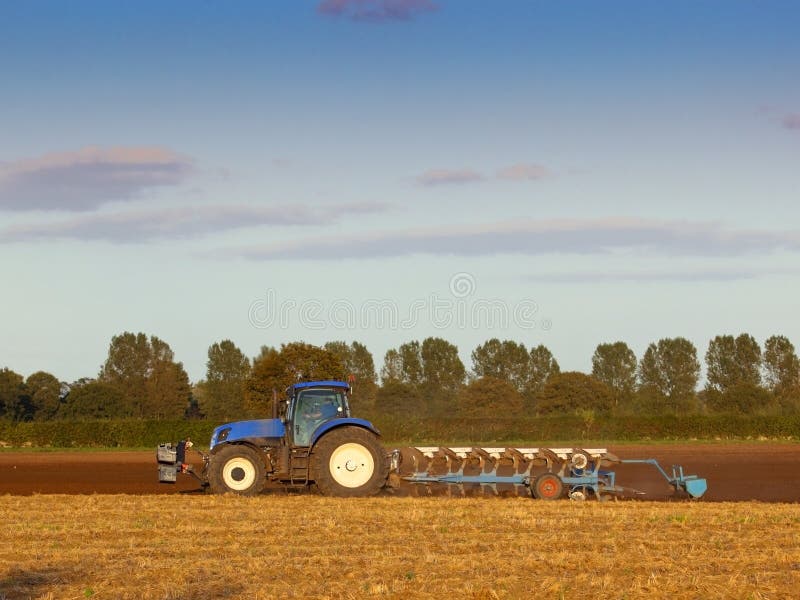 Plowing and rolling stock image. Image of farming, farm - 10910919