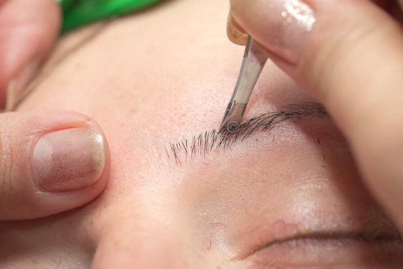 Plucking Eyebrows in Cosmetology Stock Photo - Image of complexion ...