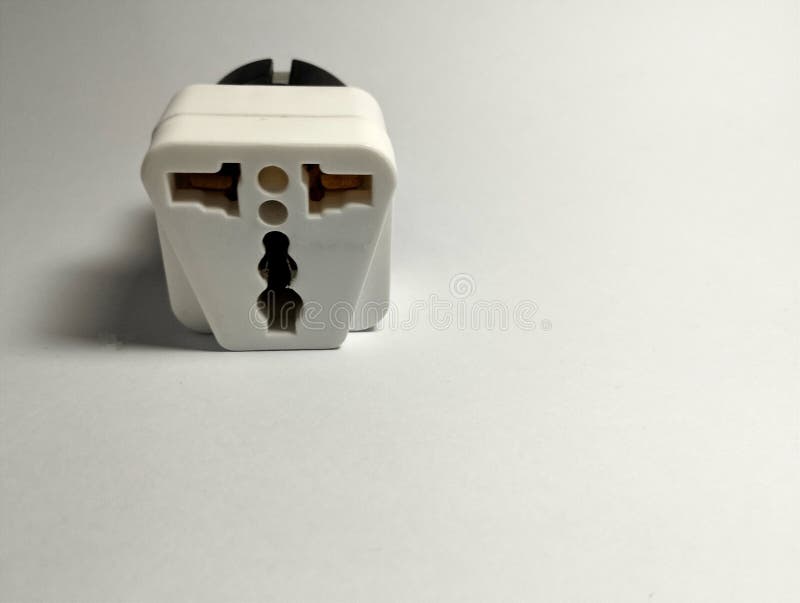 Plug in Adapter with Three Holes on the Top of White Backgrpund Studio ...