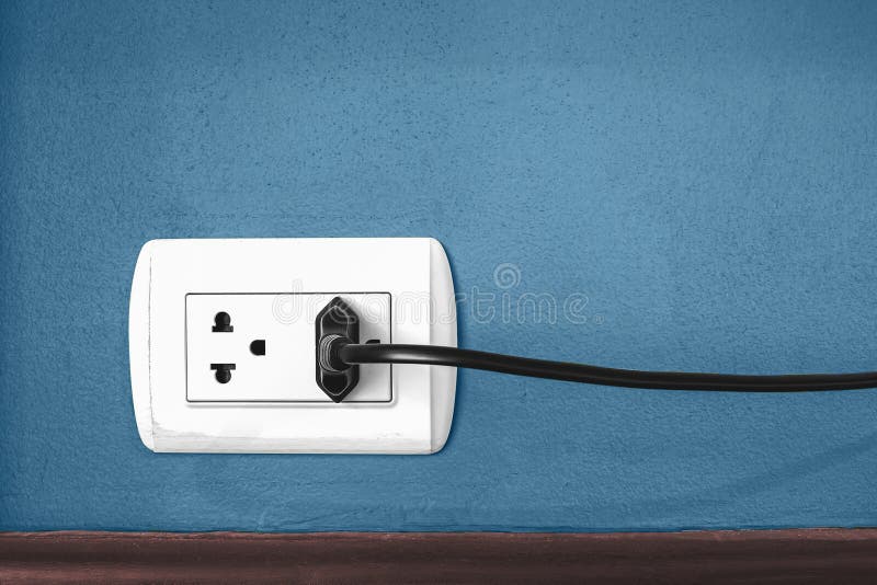 Plug on blue wall stock image. Image of voltage, cord - 63220005