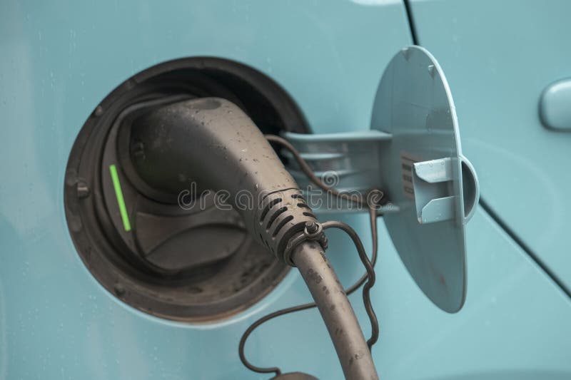 Plug in of an electric car stock image. Image of plug - 277602281