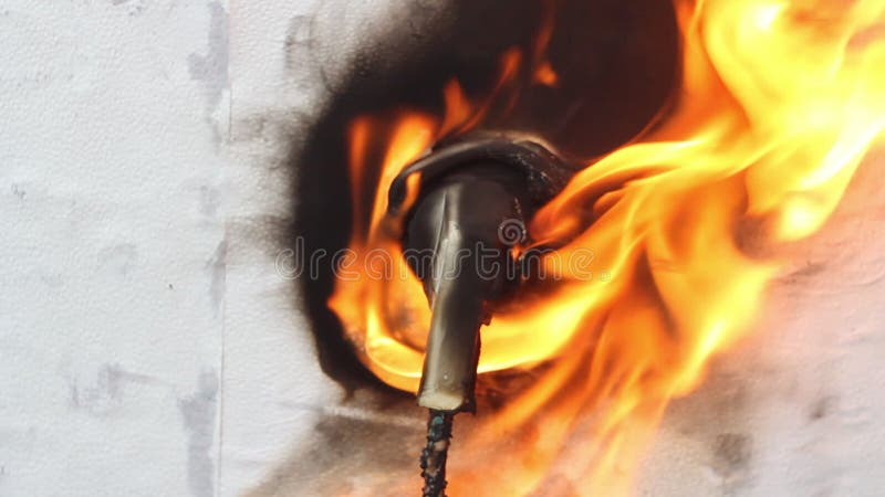 The Plug from the Electrical Appliance Inserted into the Socket Burns ...