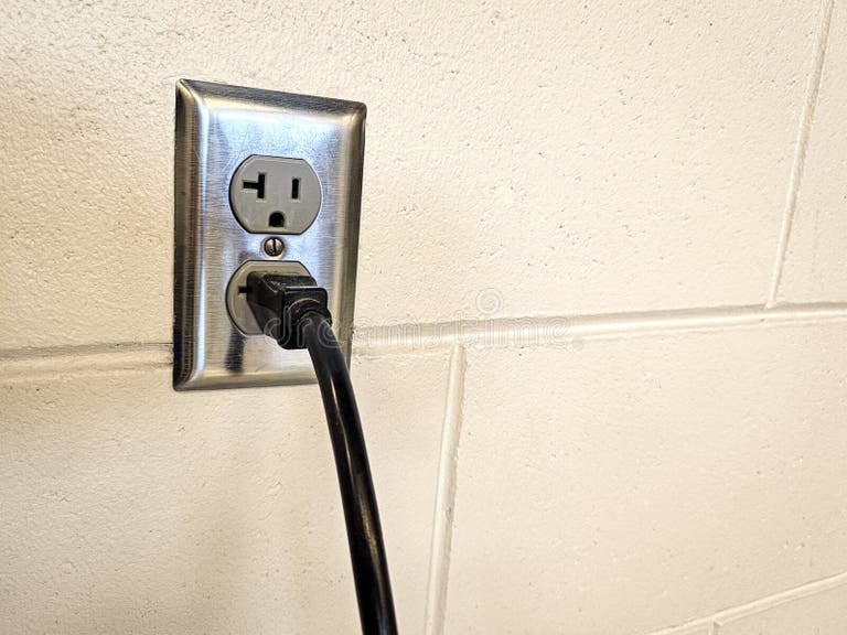 Black Cable Plug in Electrical Socket Closeup at an Angle Stock Image ...