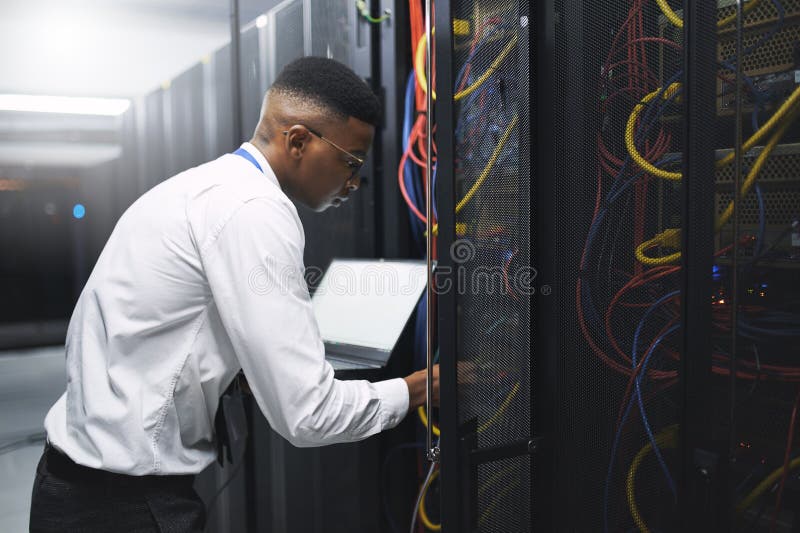 Plug into a Higher Level of Security. a Young Male Technician Working ...