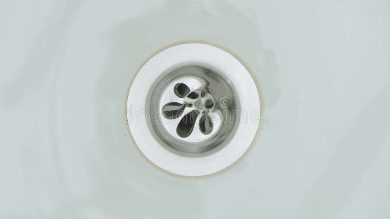 The Plug Was Pulled Out and the Water Began To Drain into the Drain ...