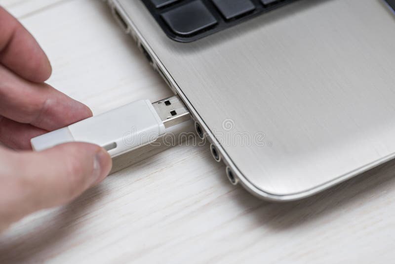 Plugging Removable Flash Disk Memory into Laptop USB Slot. Man Hand ...