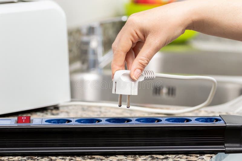 Plugging a Toaster into the Electrical Outlet Stock Photo - Image of ...