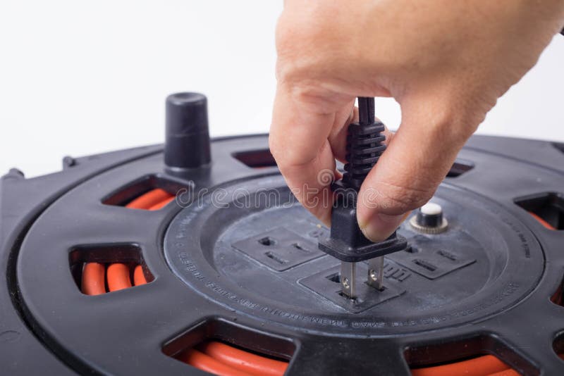 Man Plugging in or Unplugging an Electrical Plug in a Socket Stock ...