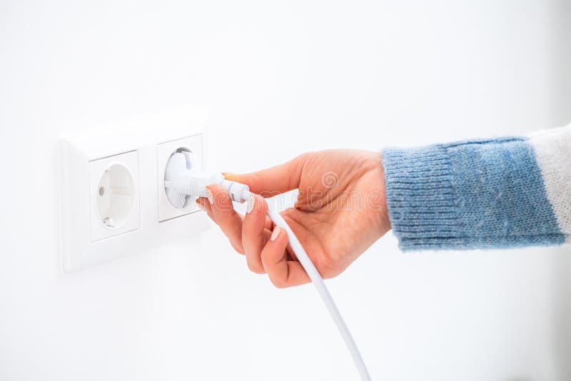 Plugging wire into socket stock image. Image of wire - 212345317
