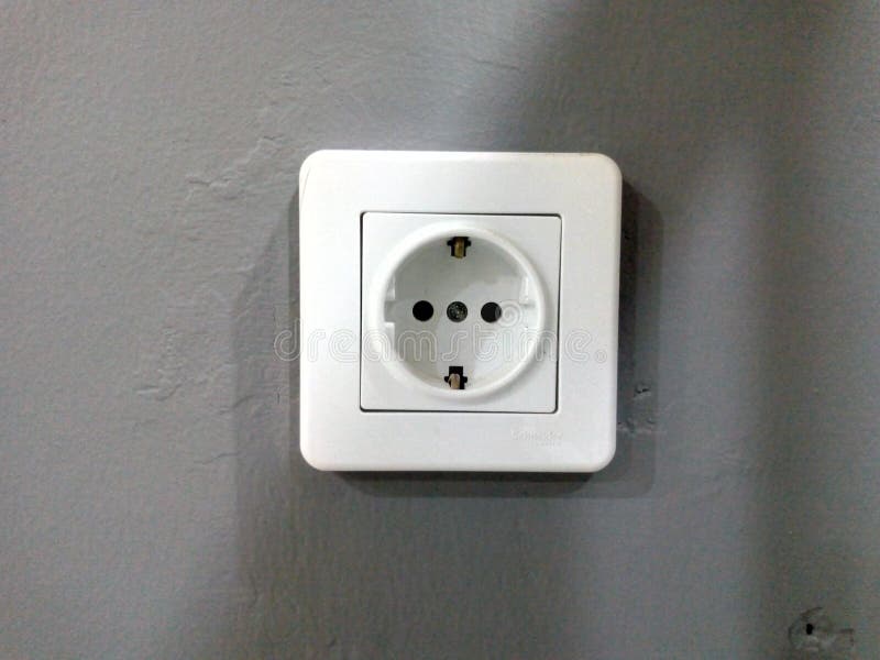 Two Plugs in Electrical Outlet on Wall. Stock Photo - Image of object ...