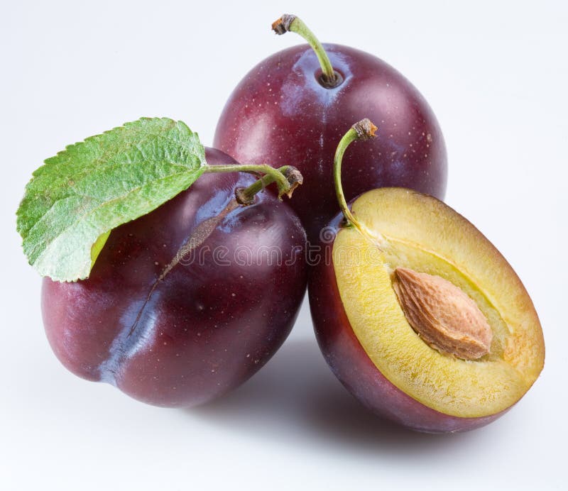 Three plums with leaf. stock photo. Image of organic - 35950524