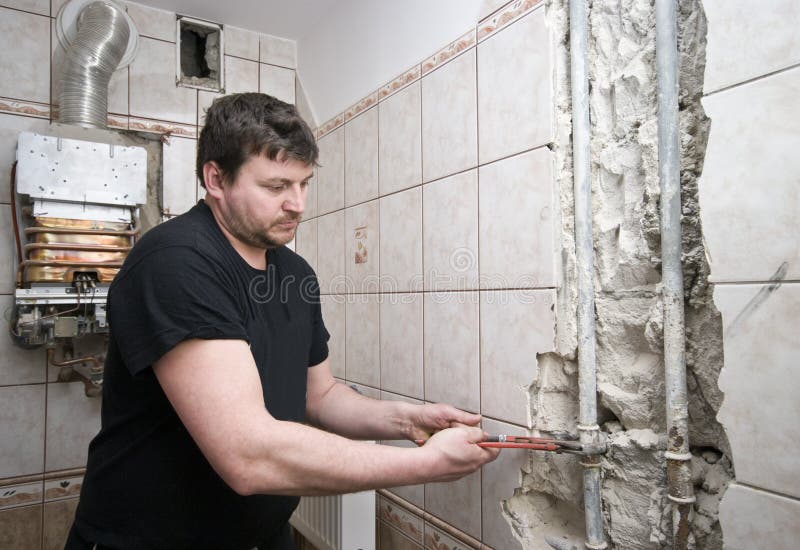 Plumber at work stock photo. Image of work, wearing, home - 5186062