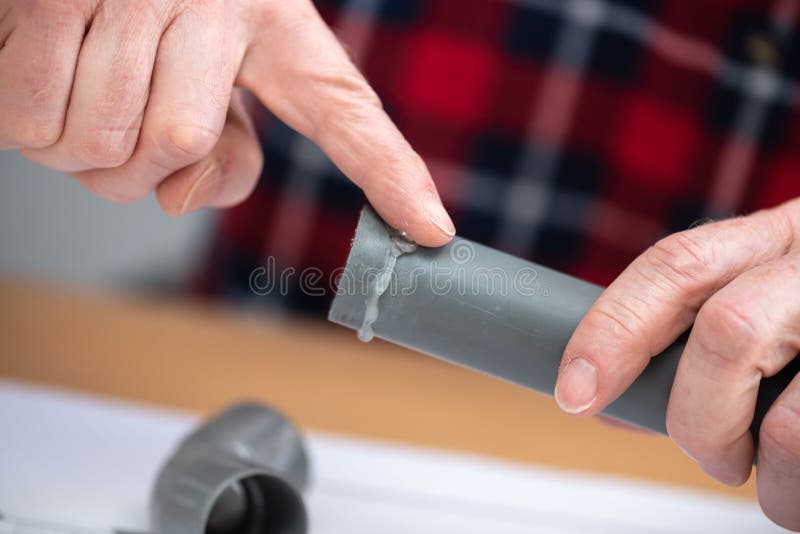 Plumber Applying Glue on Pvc Pipe Stock Image - Image of plumbing ...